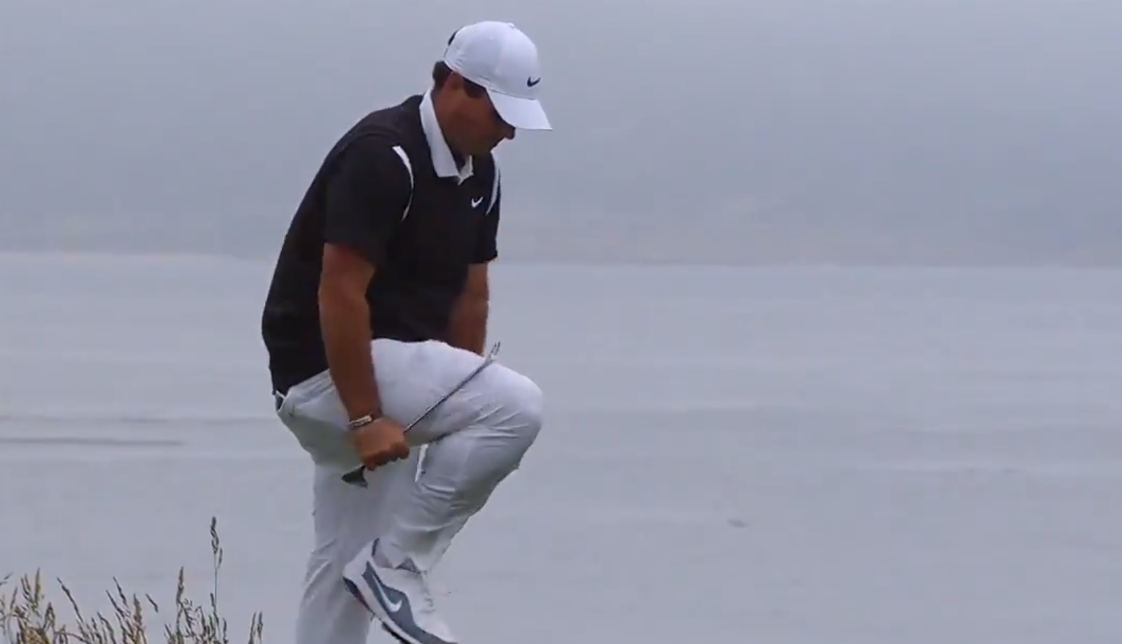 WATCH: Patrick Reed snaps his wedge over his knee, avoids 18th hole ...