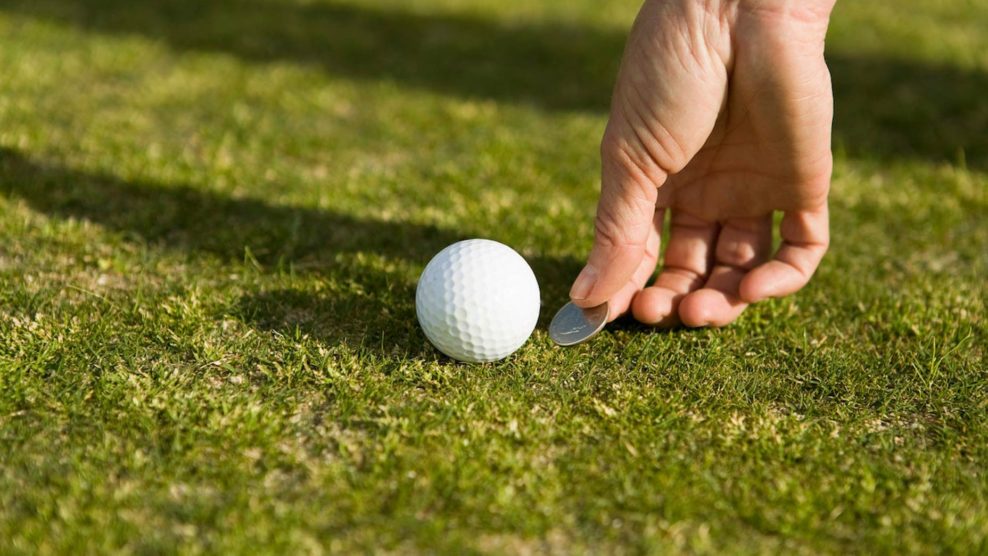 Where on the golf course can you pick up and clean your golf ball?